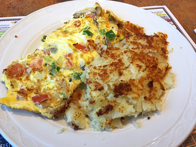 The Western omelet and hash browns arrive like a morning power couple &ndash; one fluffy and stuffed with veggies, the other crispy and golden.
