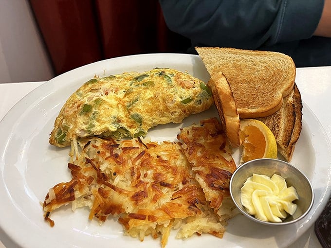 This omelet doesn't just arrive at your table&mdash;it makes an entrance, flanked by crispy hash browns that audition for the role of breakfast's best supporting actor.