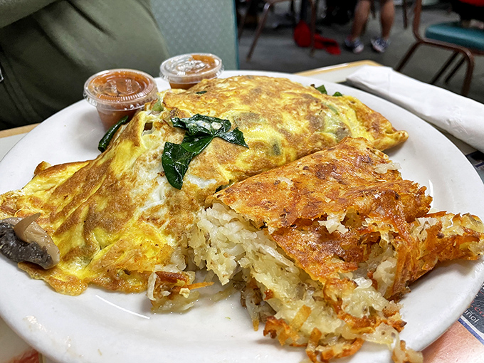 This veggie omelet isn't trying to win beauty contests &ndash; it's too busy delivering flavor bombs alongside hash browns that achieved the golden-brown perfection we all attempt at home.