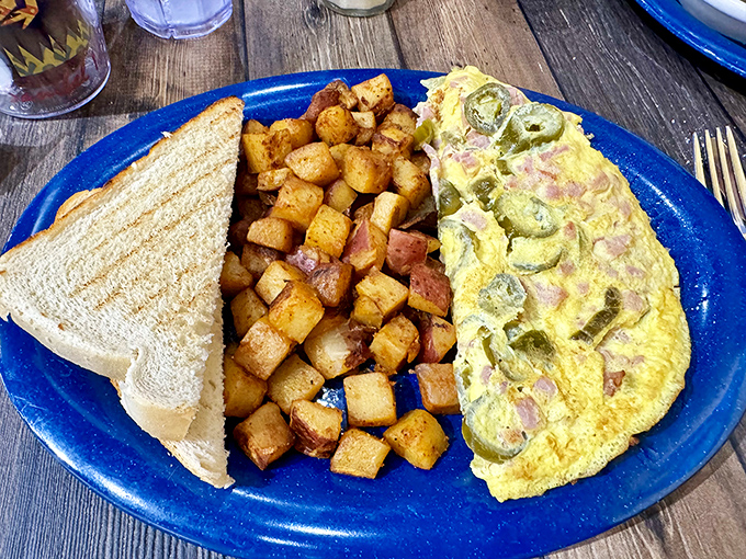 This isn't just any omelet&mdash;it's a masterclass in morning perfection, with home fries so perfectly seasoned they deserve their own fan club.