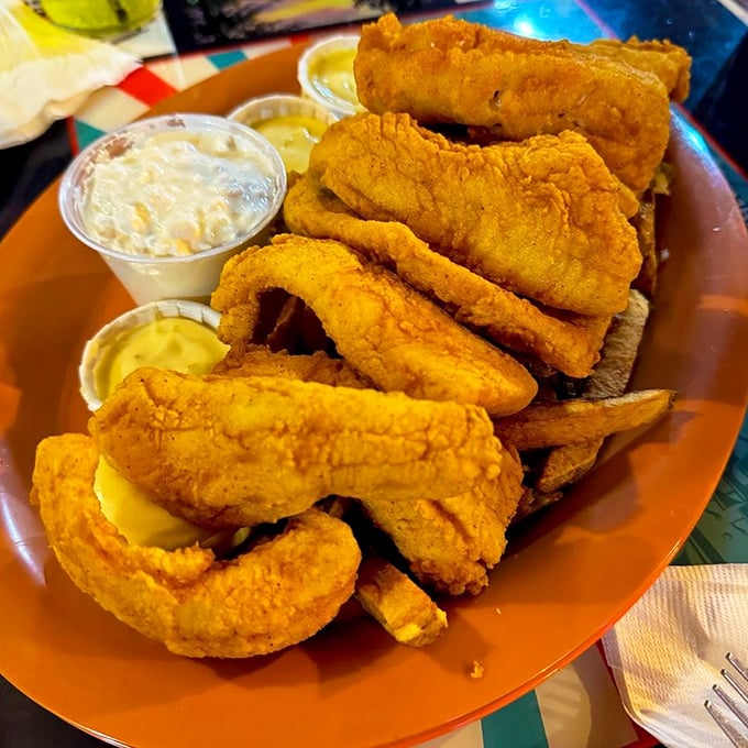 Golden-brown perch piled high like edible gold doubloons. This isn't just dinner; it's an Ohio fishing expedition that someone else handled for you.