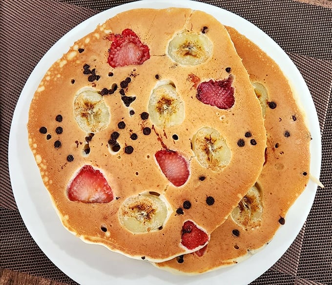 Fruit and pancake alchemy at its finest&mdash;where strawberries and bananas aren't just toppings, they're full-fledged breakfast celebrities. 