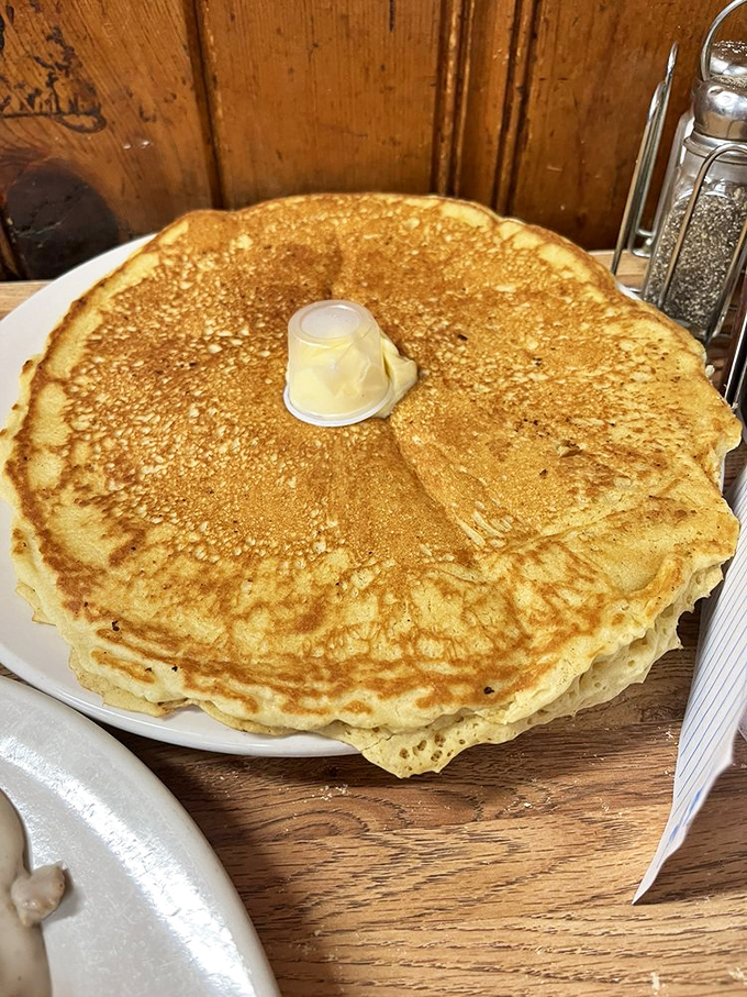 Pancake perfection in its purest form. That pat of butter melting in the center is like a bullseye on a target of golden-brown breakfast bliss.