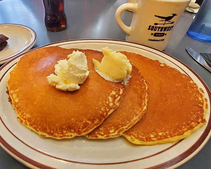 Golden pancakes with melting butter pats that look like tiny islands in a sea of maple syrup potential. Resistance is futile.