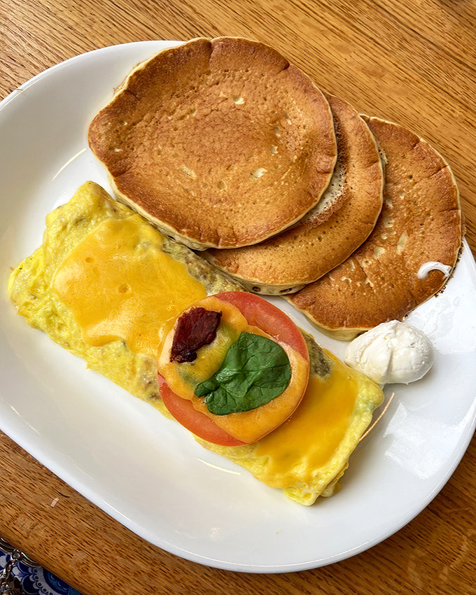 Pancake stacks and omelets that make you question why you ever eat anything else. That tomato garnish is basically a vegetable serving, right?