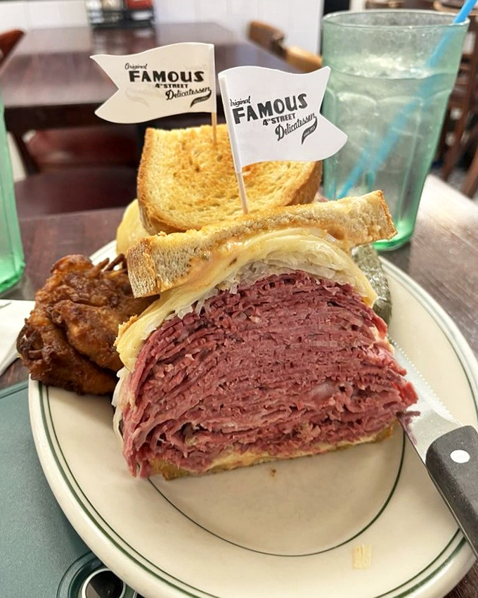 Not so much a sandwich as a skyscraper of meat with bread bookends. This Pastrami Reuben requires strategic planning and an elastic jaw.