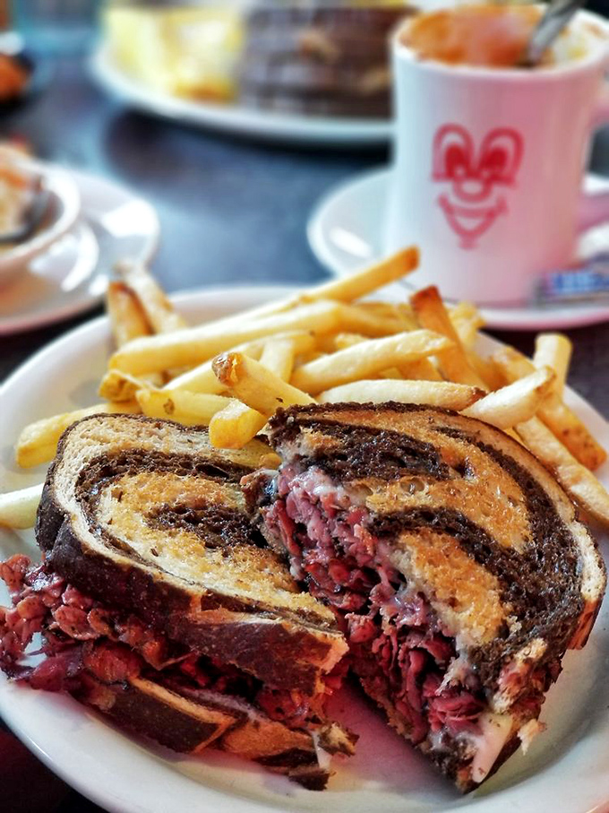 The Reuben reveals its glorious interior&mdash;a pink mountain of corned beef nestled between perfectly grilled marble rye. Worth every napkin.