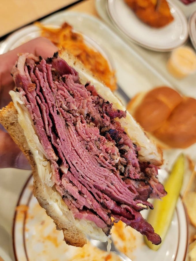Not just a sandwich, but an architectural feat &ndash; layers of pink pastrami piled higher than some downtown buildings.