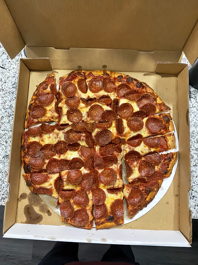 This pepperoni pizza isn't just food—it's edible architecture with those perfectly curled cups creating tiny flavor reservoirs of happiness.
