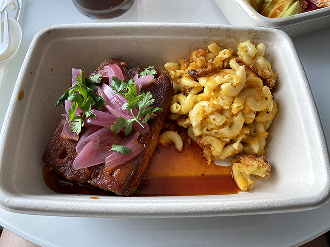 That pork chop isn't just dinner, it's a commitment to excellence, while the mac and cheese plays a supporting role worthy of an Oscar.