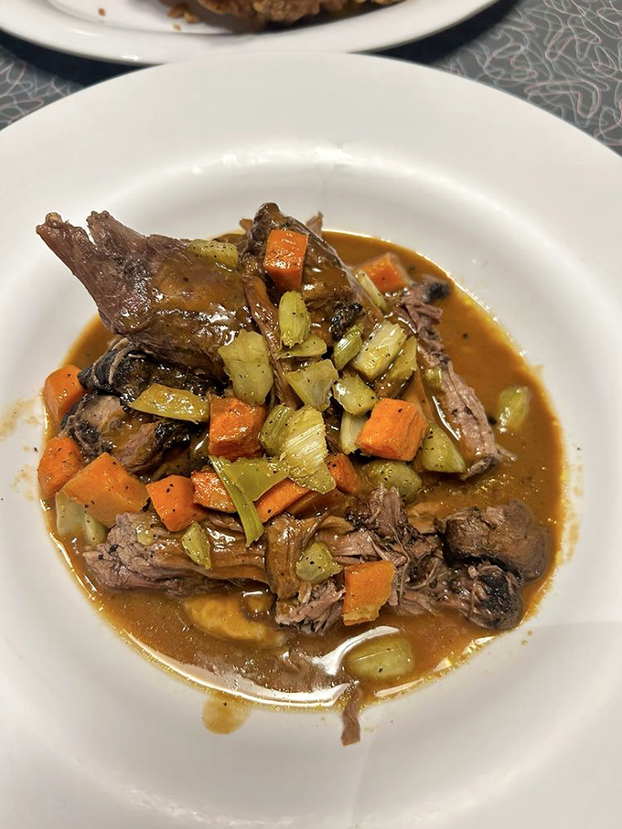Mom's pot roast doesn't just fall apart—it surrenders completely, waving the white flag in a pool of rich gravy and perfectly cooked vegetables.
