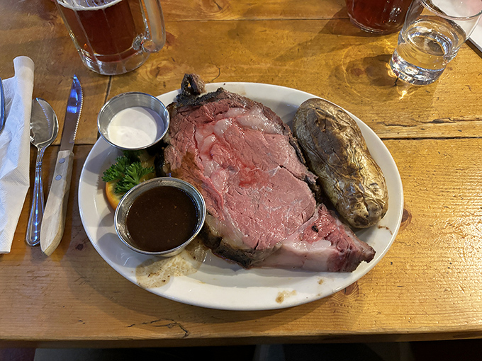 The star of the show arrives: prime rib so perfectly pink it could make a vegetarian question their life choices, accompanied by a baked potato that's practically begging for attention.