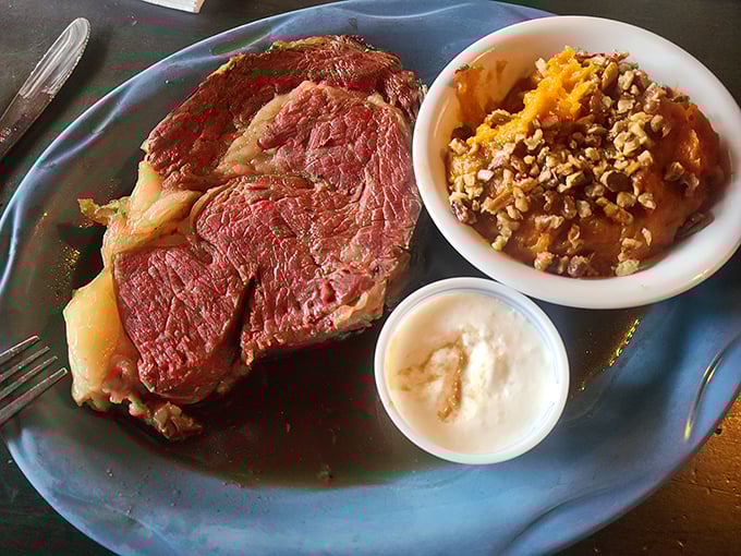 Prime rib perfection: that rosy center, that savory jus, that horseradish cream. This isn't dinner; it's a religious experience with better seating.
