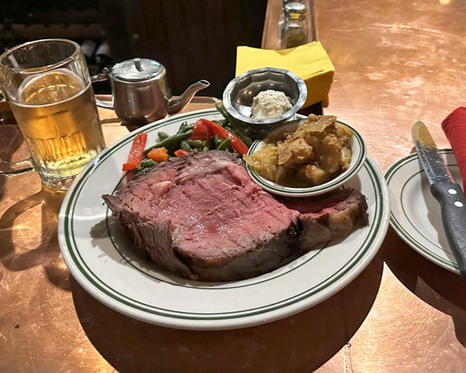 This isn't just prime rib; it's a carnivore's sonnet. The perfect pink center whispers sweet nothings to your taste buds.