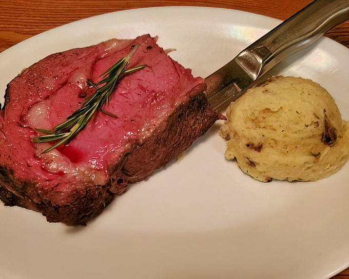 The star of the show: prime rib so perfectly pink it could make a vegetarian question their life choices, accompanied by a scoop of mashed potatoes standing by for support.