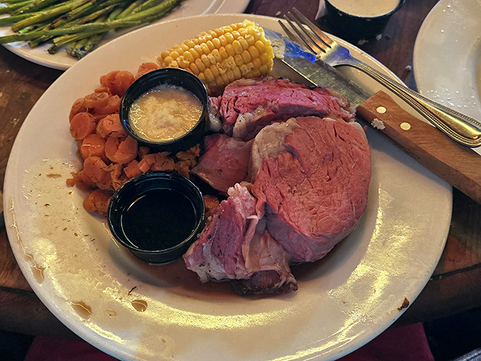 Behold the prime rib masterpiece - perfectly pink, tender enough to cut with good intentions and better company.