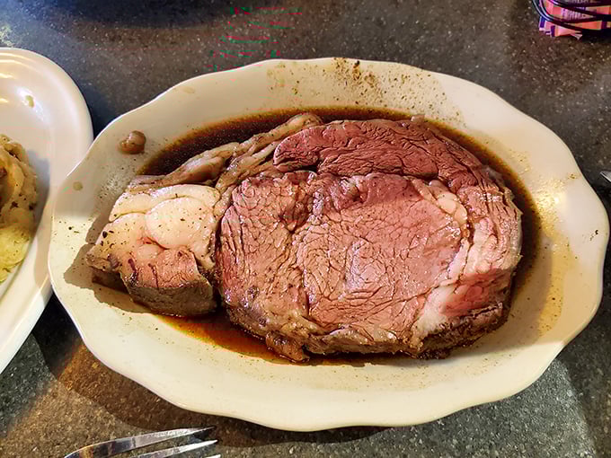 This isn't just prime rib; it's a monument to patience. Slow-roasted perfection swimming in a pool of savory au jus that demands bread for sopping.