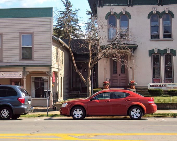 Victorian and Italianate buildings stand shoulder to shoulder, their different architectural personalities somehow creating the perfect neighborhood rather than a stylistic argument.
