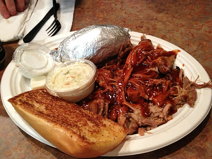 Pulled pork so tender it practically surrenders to your fork, served with the kind of coleslaw that makes vegetables worth eating.