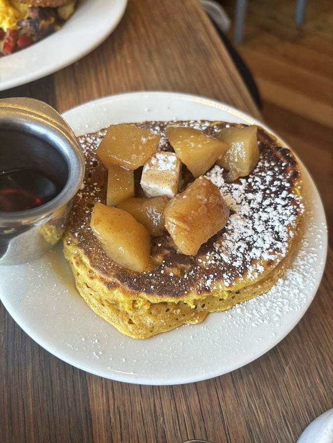 Golden pancakes crowned with caramelized fruit that would make even the most dedicated diet-follower whisper, "Worth it."