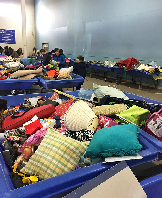 Blue bins of possibility stretch across the warehouse floor, where patient diggers sift through layers of castoffs to unearth someone else's overlooked treasures.