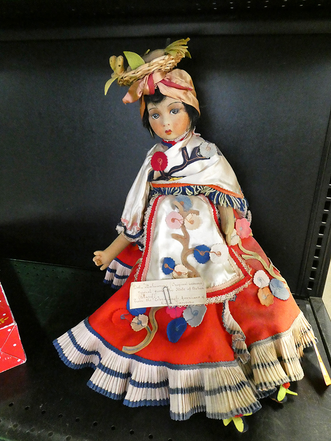 Like a tiny ambassador from another era, this intricately detailed doll stands ready to bring cultural flair to someone's collection. Craftsmanship you can't fake.