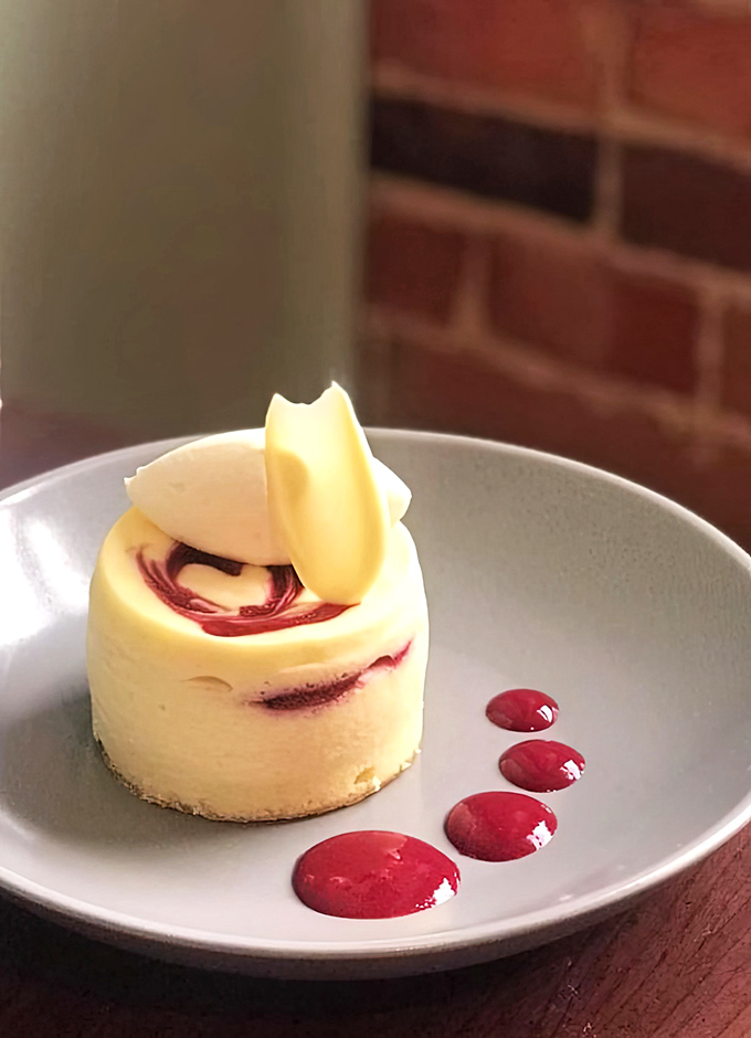 This raspberry-swirled cheesecake isn't just dessert&mdash;it's edible architecture with a perfect balance of tangy and sweet that makes taste buds stand at attention.