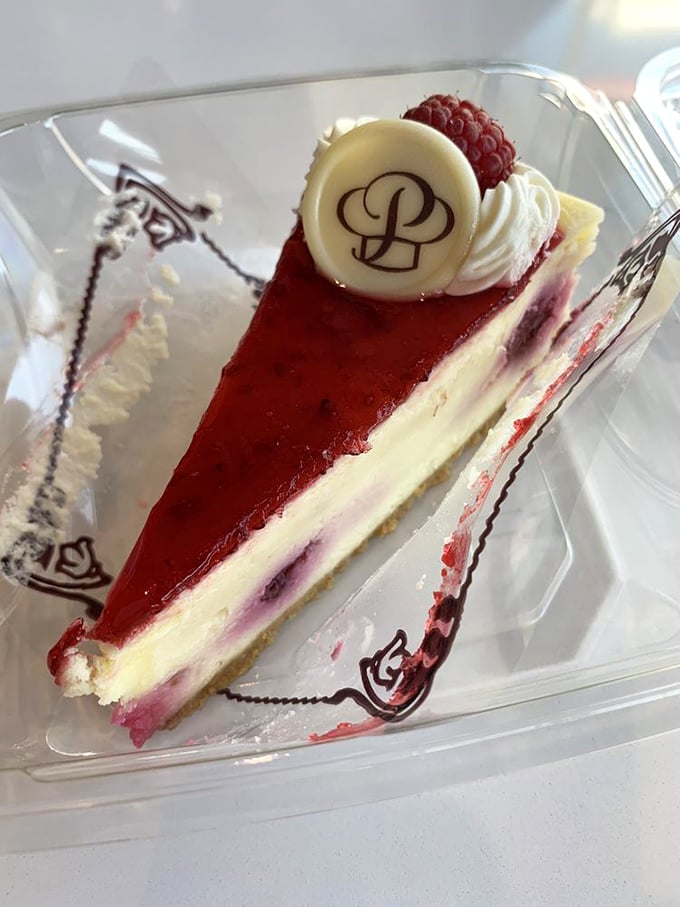 This raspberry cheesecake isn't just dessert&mdash;it's edible artwork. The perfect balance of creamy decadence and berry brightness crowned with Porto's signature medallion.