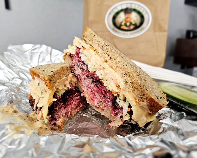 The Reuben in its natural habitat: perfectly grilled rye, Russian dressing peeking out, and corned beef so tender it practically surrenders at first bite.