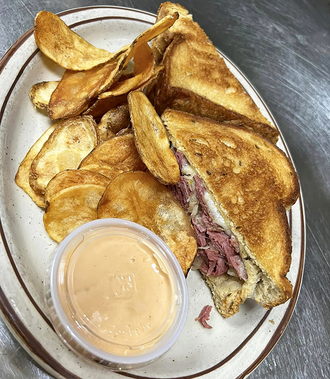 The star of the show! Golden-grilled rye cradles tender corned beef and sauerkraut, with house sauce waiting for its moment. This sandwich has purpose.