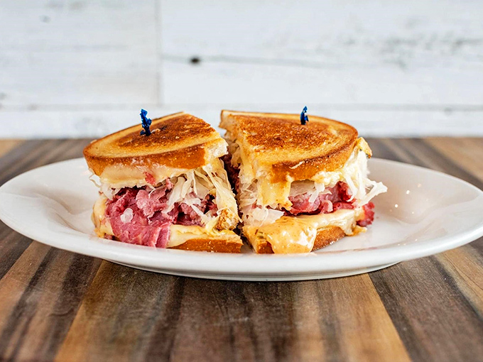 Behold the star of the show: layers of corned beef, sauerkraut, and melted cheese between perfectly grilled rye. Sandwich architecture at its finest.