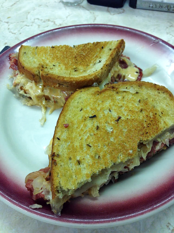 The Reuben in its natural habitat&mdash;perfectly grilled rye creating that symphony of crunch before surrendering to the tender corned beef within.