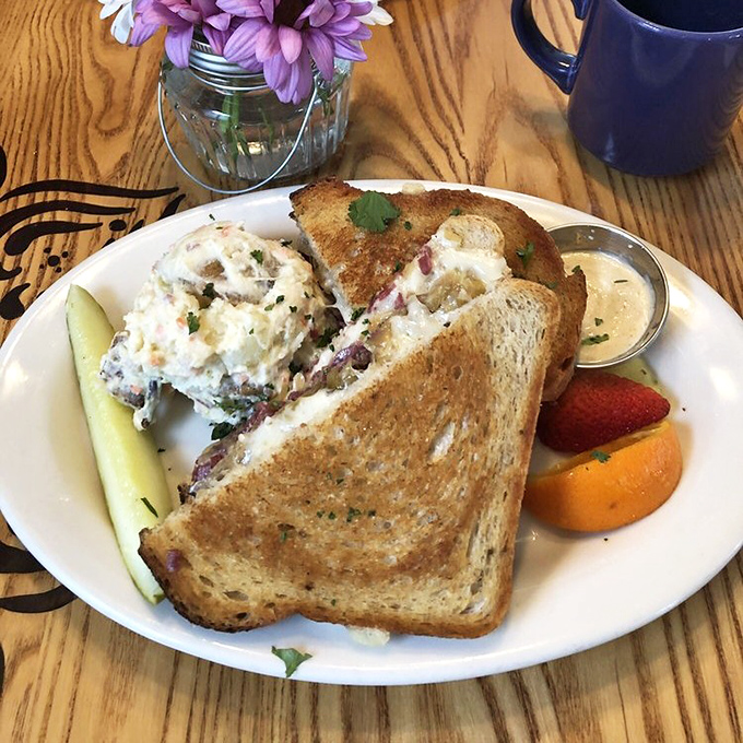 Not just any sandwich, but an architectural achievement of perfectly toasted bread, house-made corned beef, and sides that refuse to be afterthoughts.