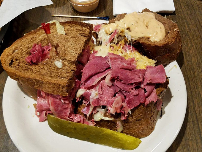 This isn't just a Reuben sandwich &ndash; it's a skyscraper of corned beef that requires engineering skills just to take the first bite.