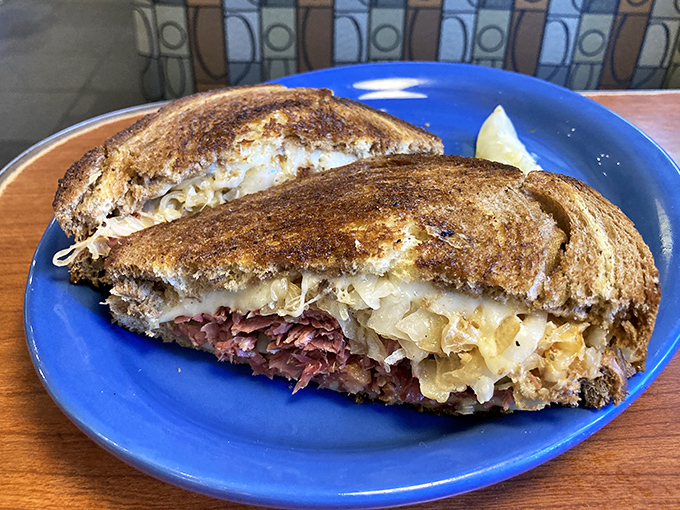 The Reuben at Sam's doesn't just satisfy hunger—it resolves existential food crises with perfect corned beef-to-sauerkraut ratios and golden-grilled rye.