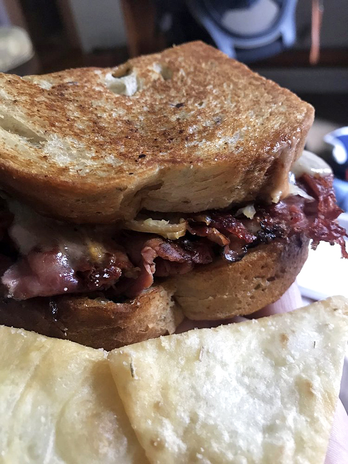 This Reuben doesn't just talk the talk&mdash;perfectly grilled rye bread barely containing a mountain of corned beef, sauerkraut, and melted Swiss.