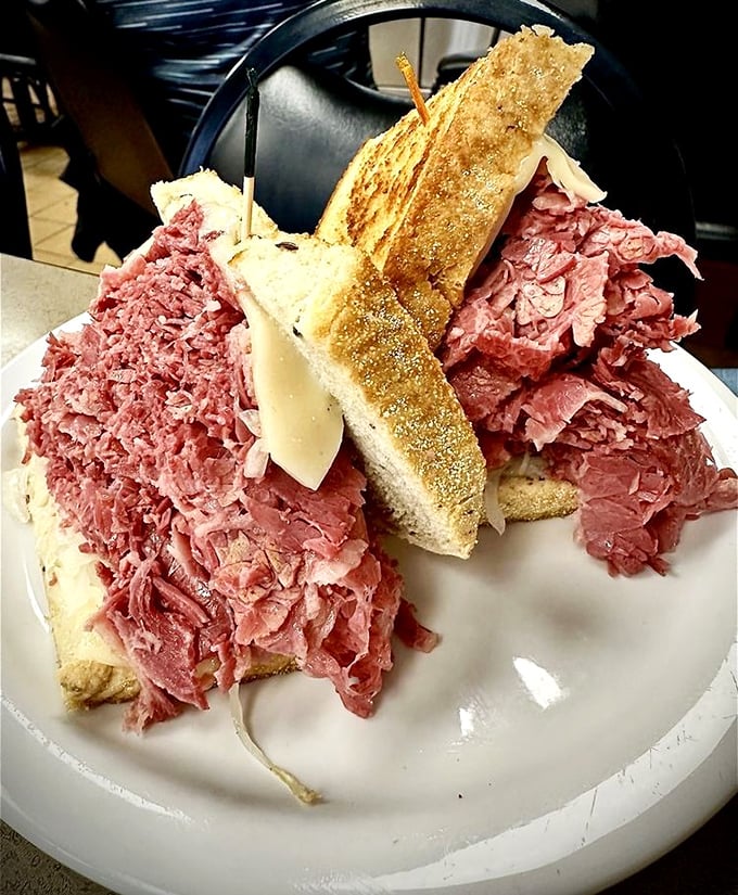 Mount Rushmore, but make it corned beef. This towering masterpiece requires both hands, several napkins, and absolutely zero shame.