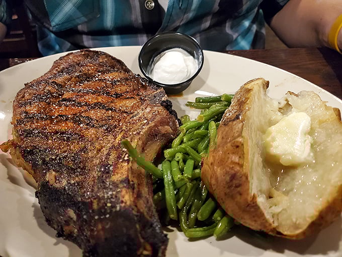 Behold the star of the show: a perfectly seared ribeye with all the right companions. That char speaks volumes about what awaits inside.