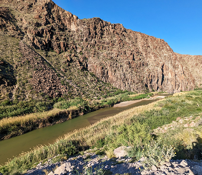 The Rio Grande carves its masterpiece through rugged canyon walls, creating a liquid border that's been sculpting this landscape since before politics existed.