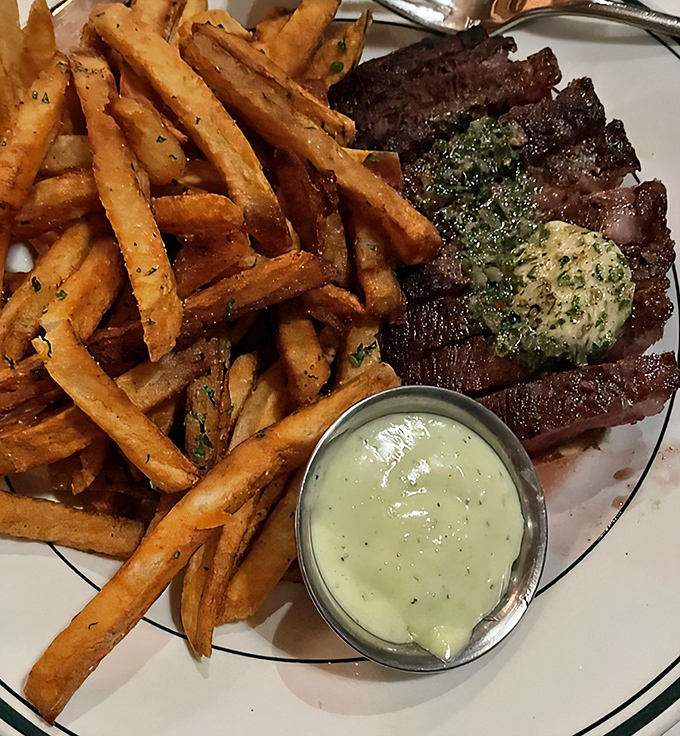 Steak fries with attitude and herb butter melting seductively on perfectly seared beef. This plate doesn't need fancy plating to tell its delicious story.