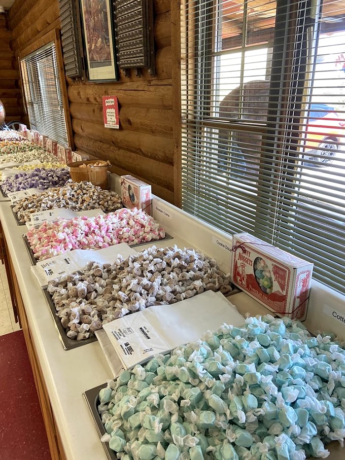 Taffy heaven awaits! Rows of pastel-colored treats in every imaginable flavor sit like edible jewels behind the rustic wooden counter.