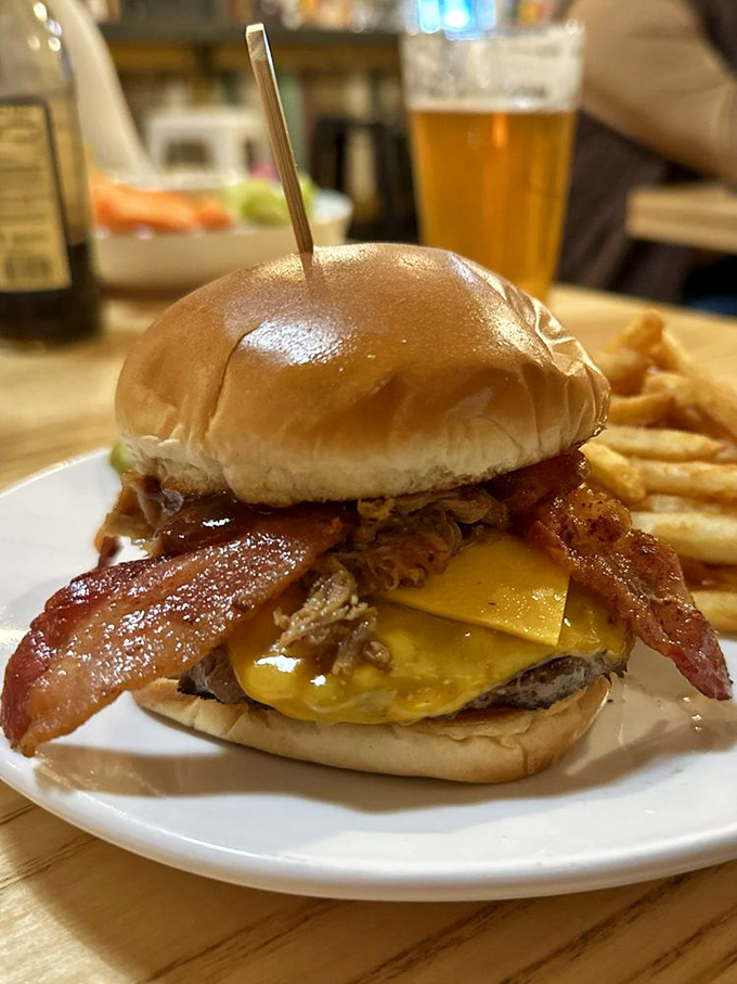 The Sam Elliott burger stands tall and proud, like its namesake. Pulled pork and bacon join forces in a tower of protein that demands respect.