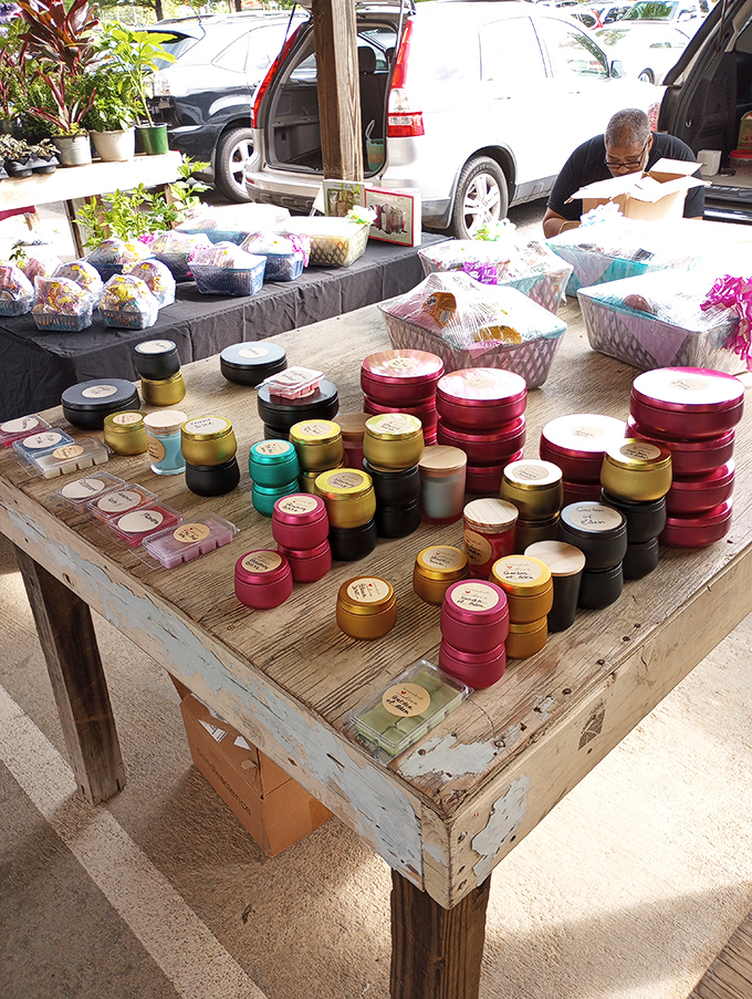 Colorful handcrafted candles line rustic tables, their scents competing for attention like contestants on a particularly fragrant reality show.