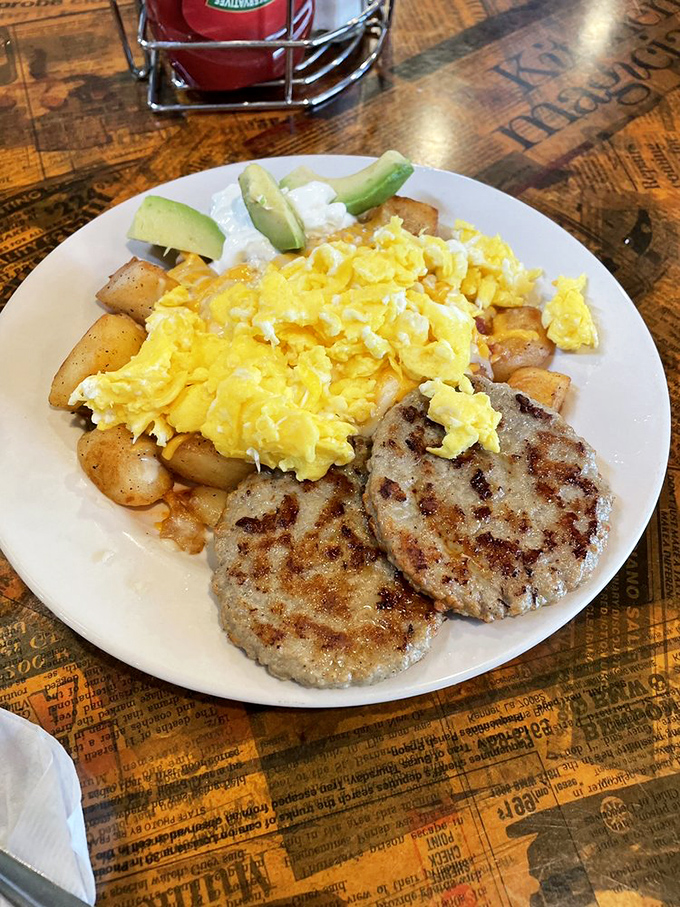 Perfectly scrambled eggs alongside savory turkey sausage patties&mdash;proof that simplicity, when done right, is the ultimate sophistication.