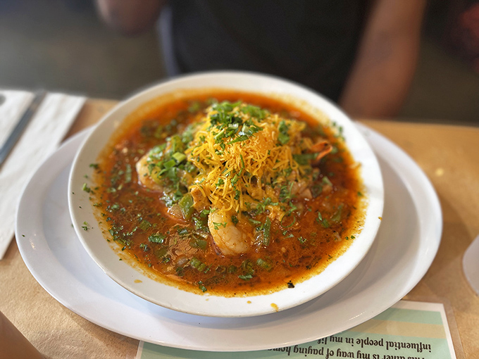 Shrimp and grits that would make Charleston jealous. Those plump crustaceans swimming in savory broth with a crown of cheese are basically edible therapy.