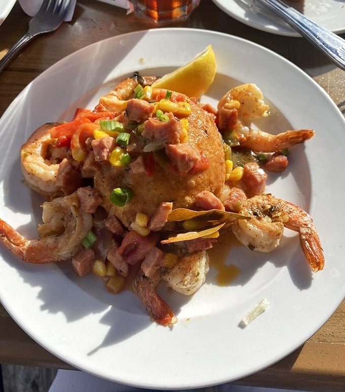 This isn't just shrimp and grits; it's a Southern hug on a plate. The colorful medley of toppings transforms comfort food into celebration food.