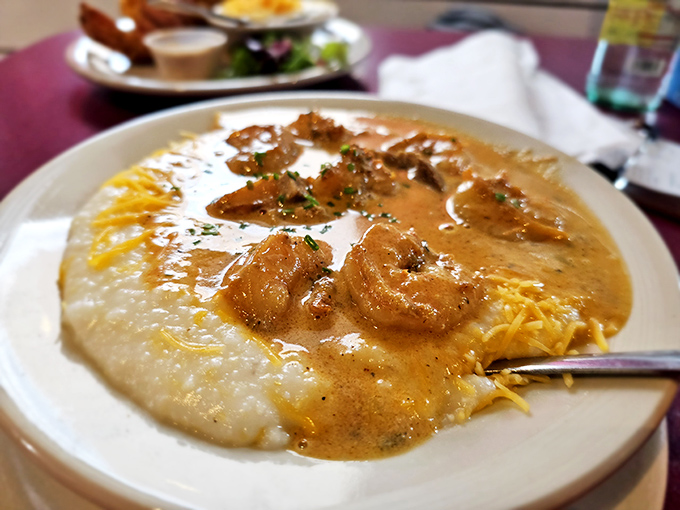 Creamy grits cradle plump shrimp in a sauce that whispers, "Take your time, sugar." Southern comfort in its most delicious form.