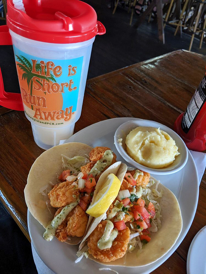 These shrimp tacos aren't just a meal, they're a beach vacation wrapped in a tortilla. The cup's motto says it all: "Life is Short. Run Away."