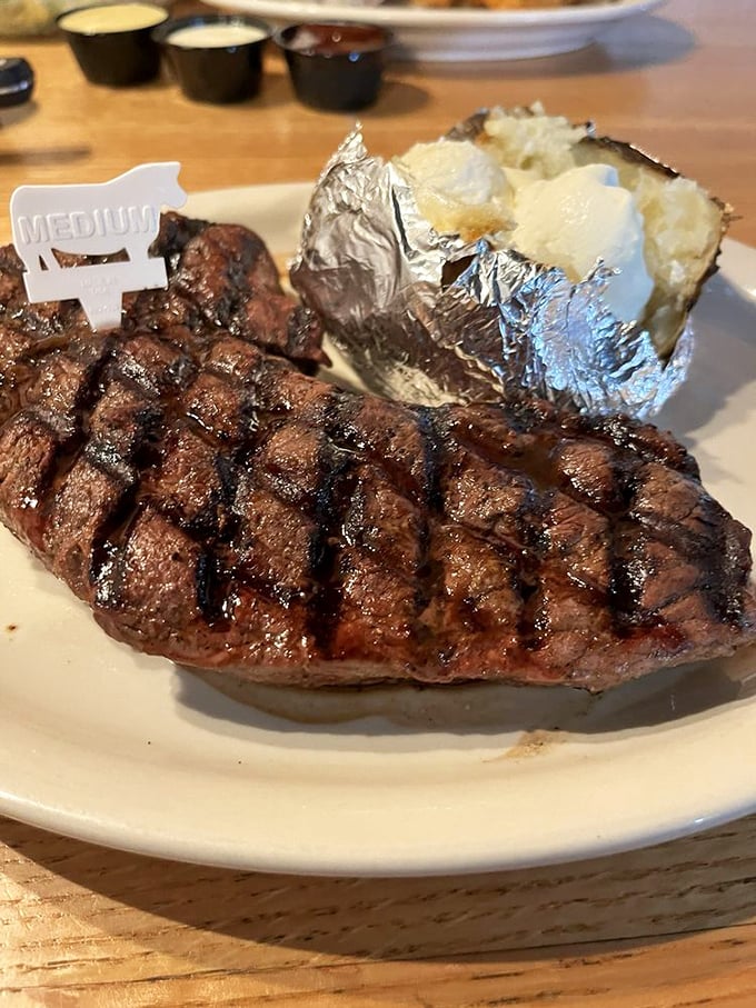 That perfect cross-hatched grill mark isn't just for show&mdash;it's a promise kept between chef and diner. The little "Medium" flag is a thoughtful touch.