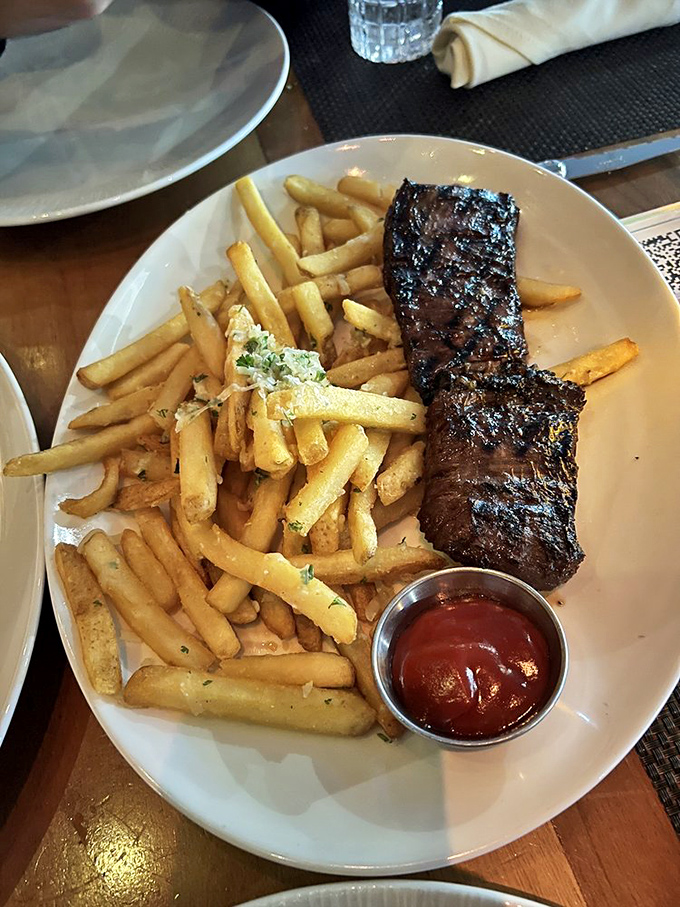 Sometimes simplicity is perfection: a perfectly seared steak alongside golden fries that manage to be both crispy and fluffy in all the right places.